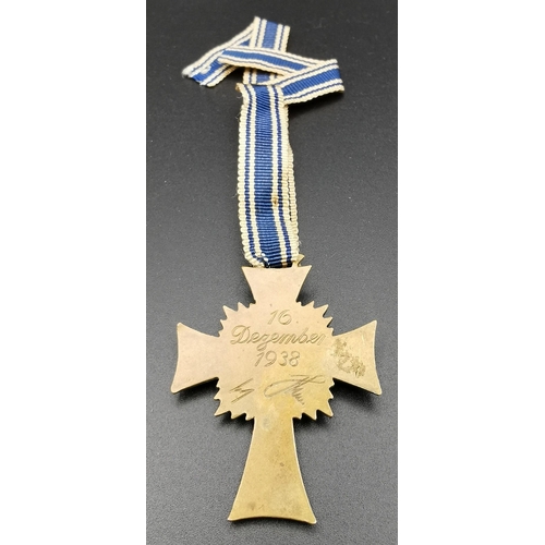 A WWII 'Cross of Honor of the German Mother' medal & ribbon. This award ...