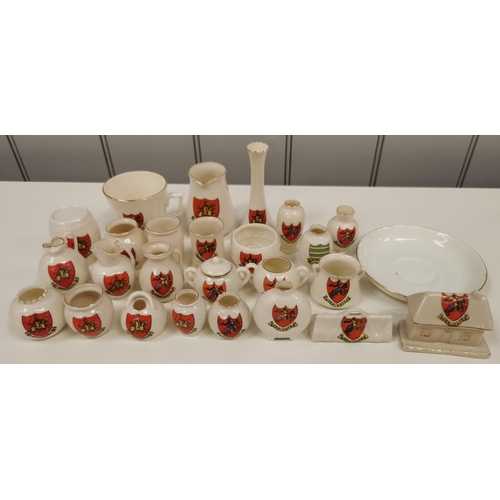 A twenty-six-piece collection of Warminster crested ware.
