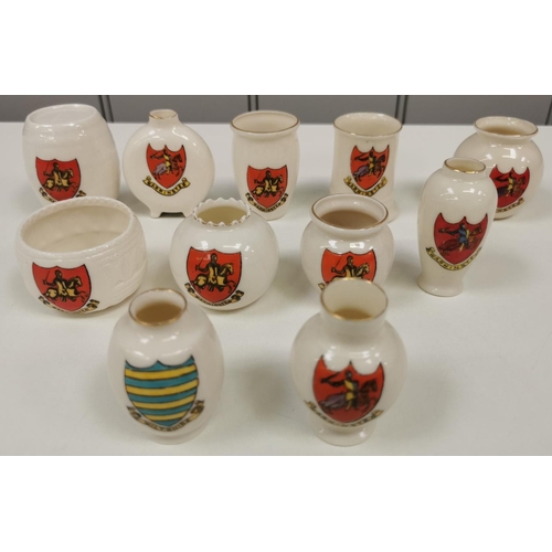 A twenty-six-piece collection of Warminster crested ware.