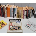 A collection of approximately twenty-six comedy & fiction books.
