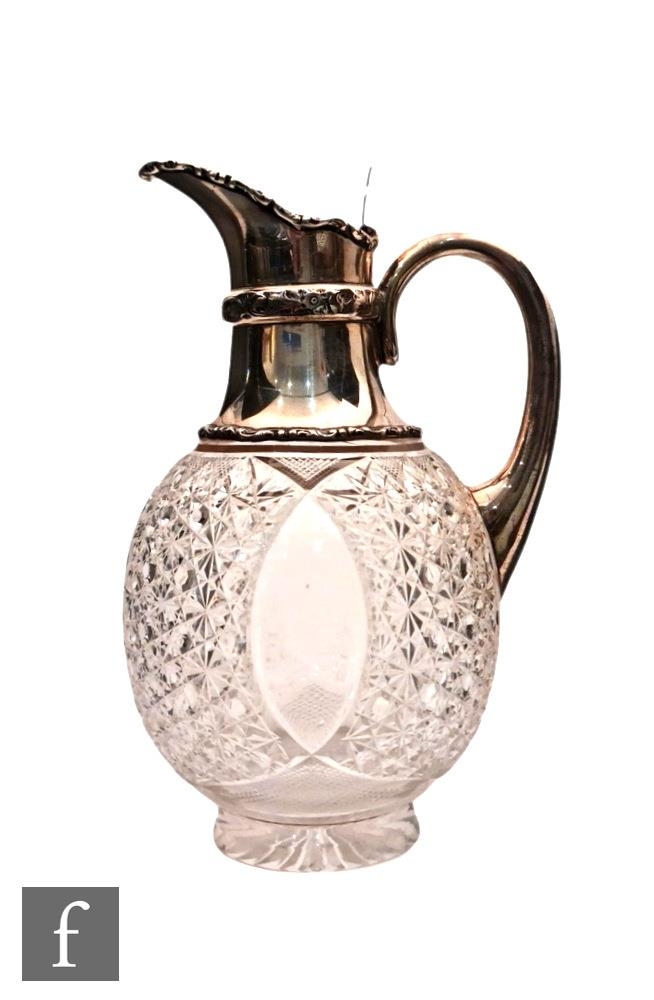 An early 20th Century hallmarked silver and clear cut glass claret jug ...