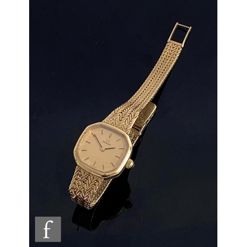 A 9ct Omega wrist watch, batons to a canted square dial, case diameter ...