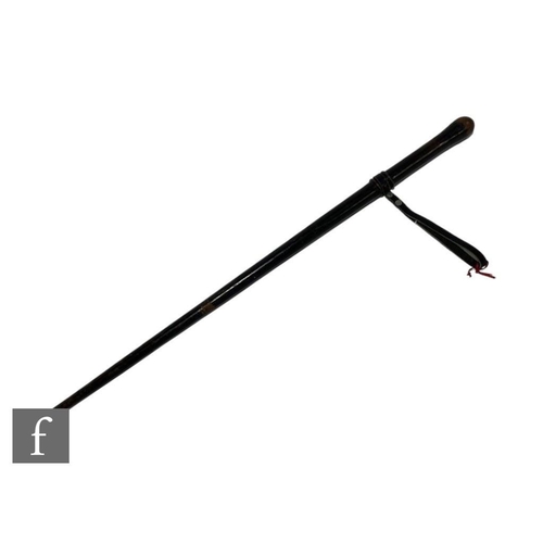 A 19th Century ebonised law enforcement night stick, later leather ...