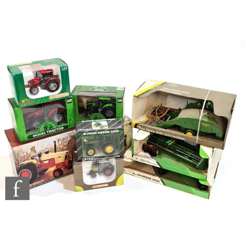 A collection of diecast model tractors and agricultural vehicles, to ...