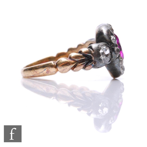 An early 19th Century ruby and diamond cluster ring, central oval ruby, length 6mm, within a border