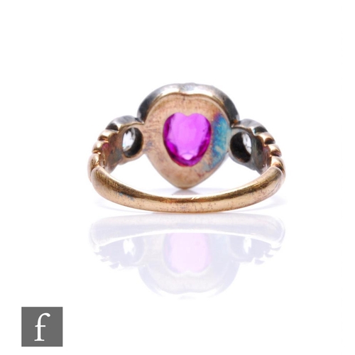 An early 19th Century ruby and diamond cluster ring, central oval ruby, length 6mm, within a border