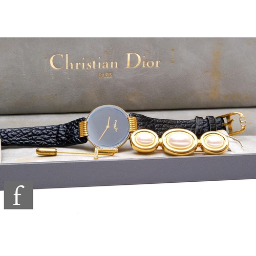 A lady's gold plated Christian Dior quartz wrist watch, gilt batons to ...