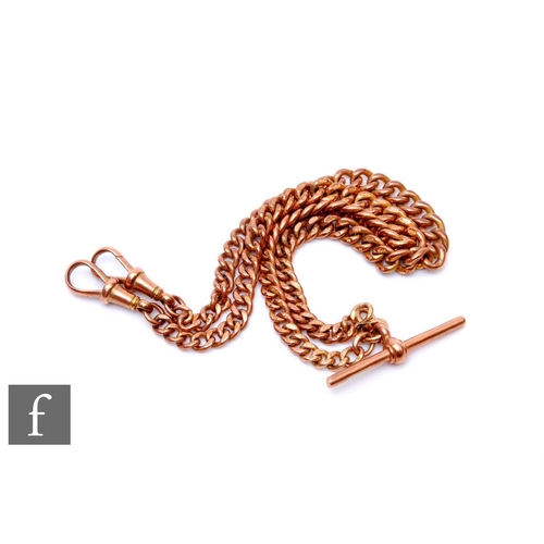 A 9ct rose gold graduated double, curb link Albert chain, terminating ...