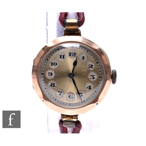 A 9ct rose gold lady's wrist watch, Arabic numerals to a circular dial ...