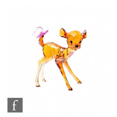 A Swarovski Crystal Disney amber glass figure, 'Bambi', modelled ...