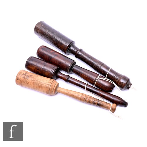 Four various turned mahogany and ash fishing priests or fleam mallets (4)