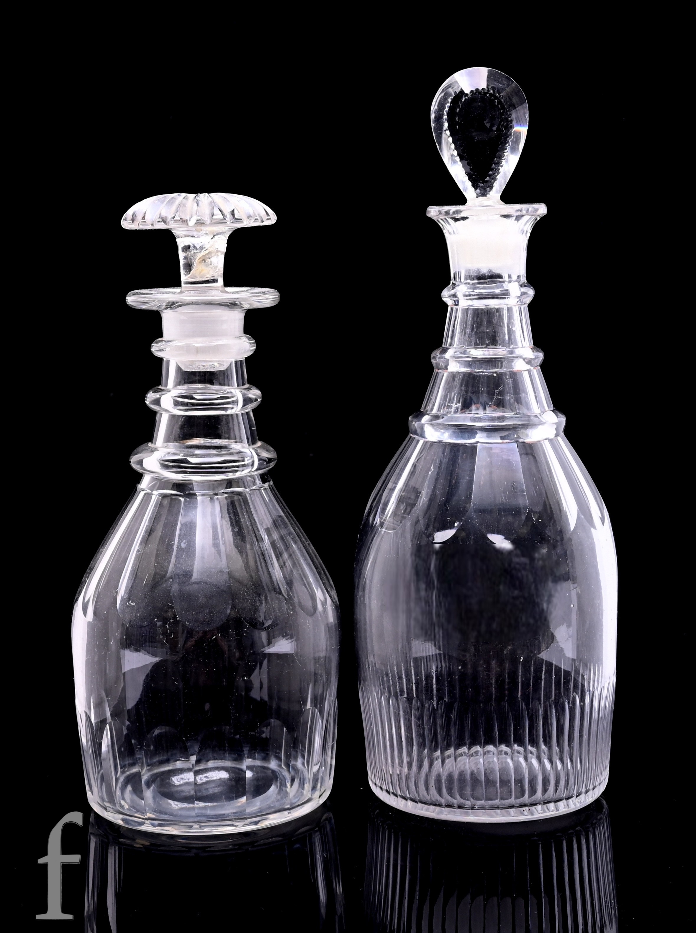 A late Georgian clear crystal decanter, the ovoid body with flute cut ...