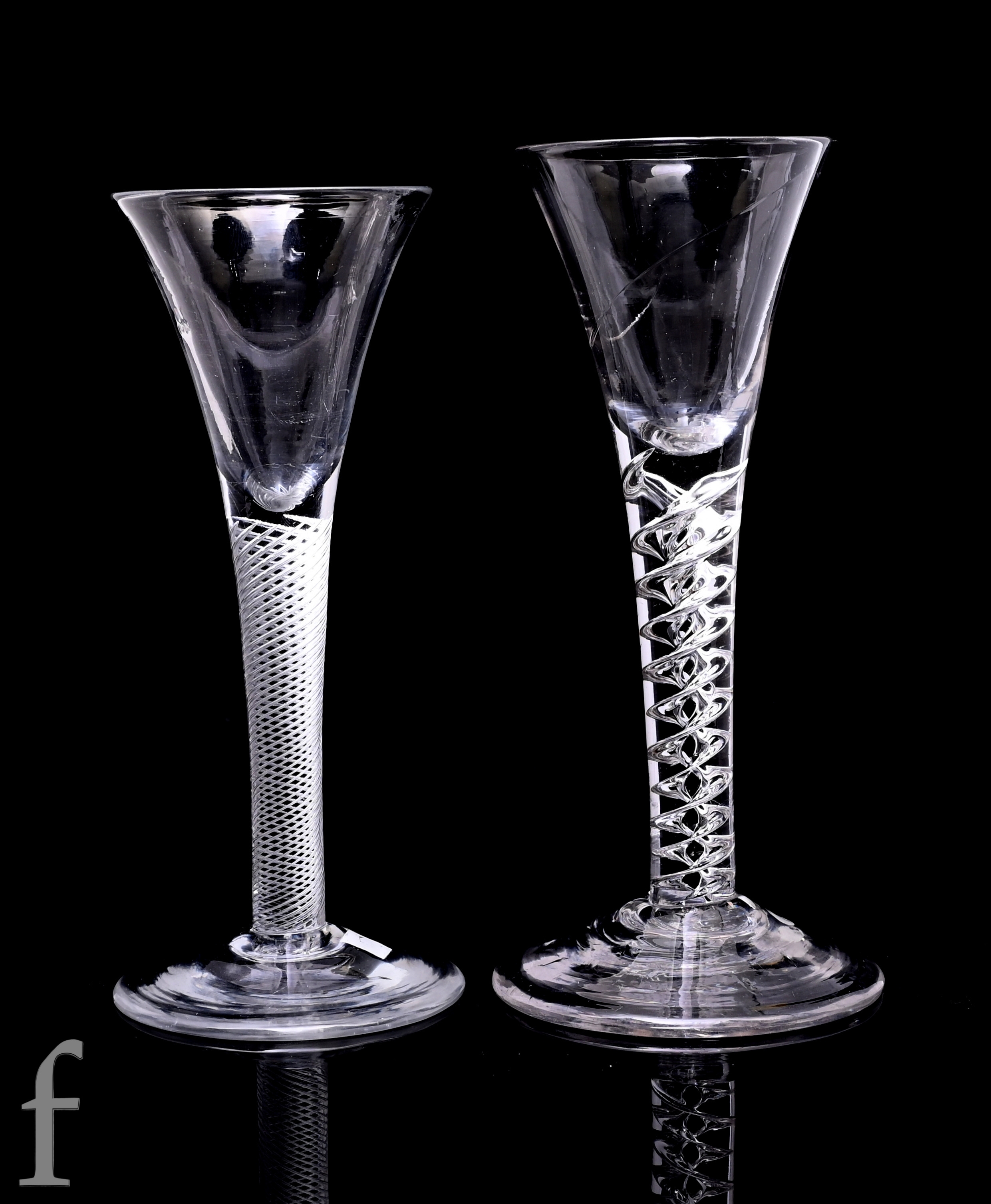 An 18th Century drinking glass circa 1750, the drawn trumpet bowl above ...