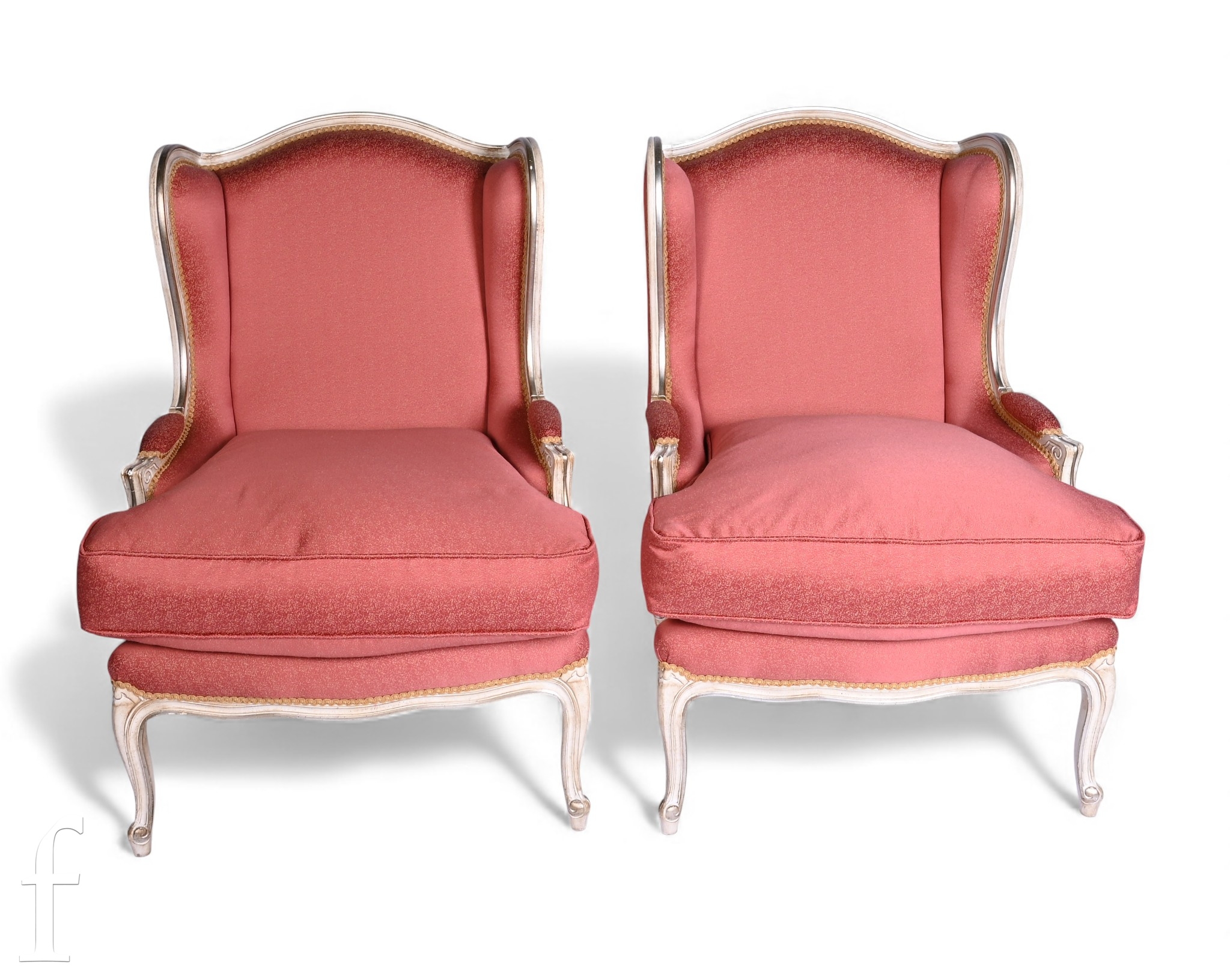 A pair of Louis XVI style white painted easy arm chairs upholstered in ...