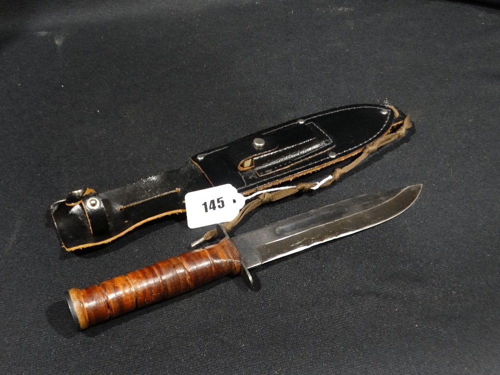 A Standard Issue US Army Fighting Knife In Leather Sheath