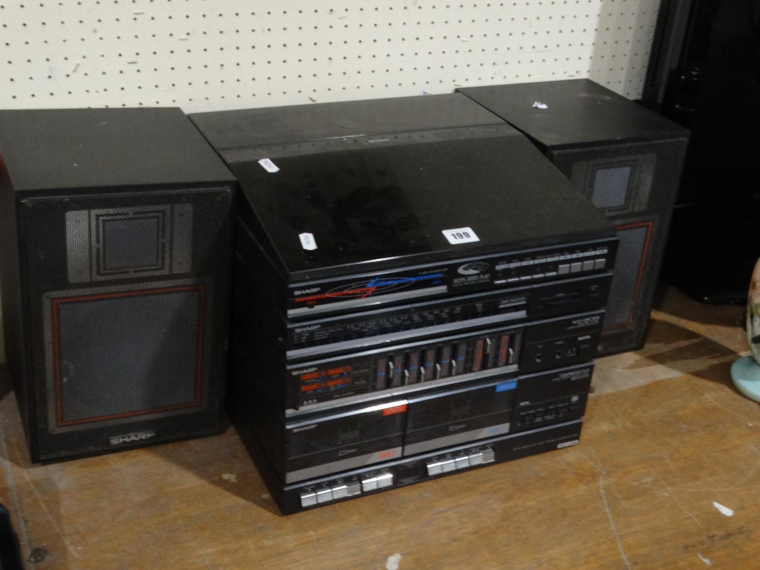 A Retro Sharp Music Centre And Speakers