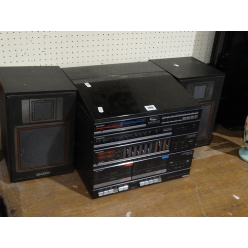 A Retro Sharp Music Centre And Speakers