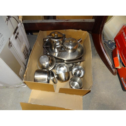 A Box Of Stainless Steel Service Ware