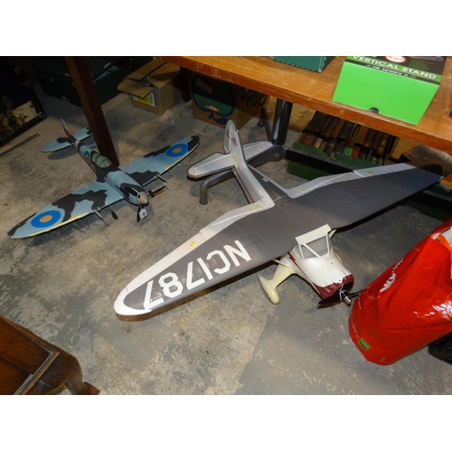 A Model Remote Control Spitfire, Together With A Similar Prop Plane