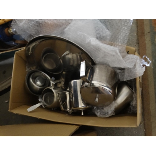 A Box Of Stainless Steel Service Ware