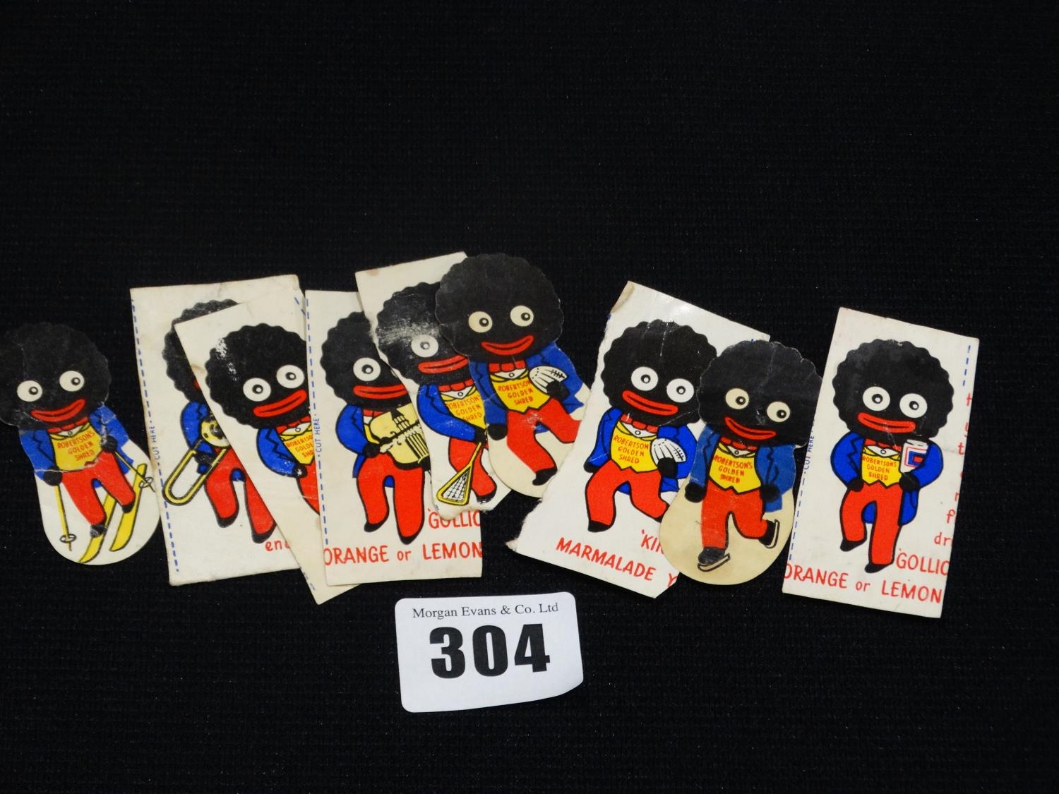 A Collection Of Robertson's Jam Stickers And Tokens