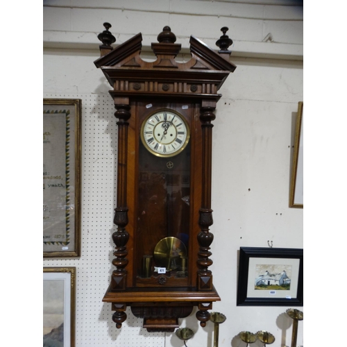 A Late Victorian Twin Weight Pendulum Wall Clock With Circular Dial