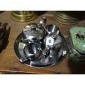 A Stainless Steel Tea Service On A Tray