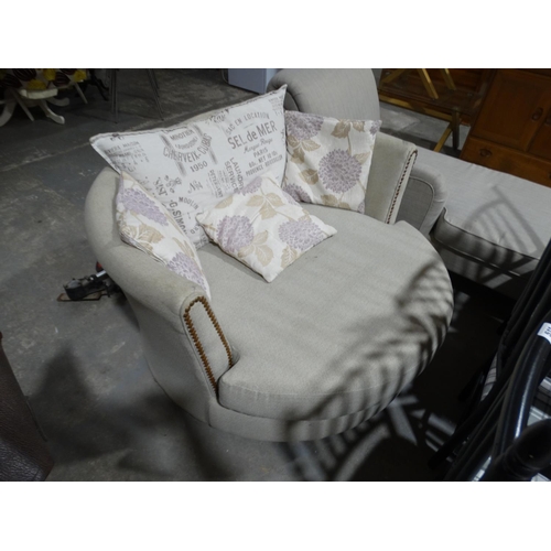 A DFS Circular Seated Revolving Easy Chair