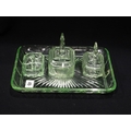 An Art Deco Four Piece Green Tinted Glass Dressing Table Set