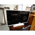 A Bush Flat Screen TV With Remote