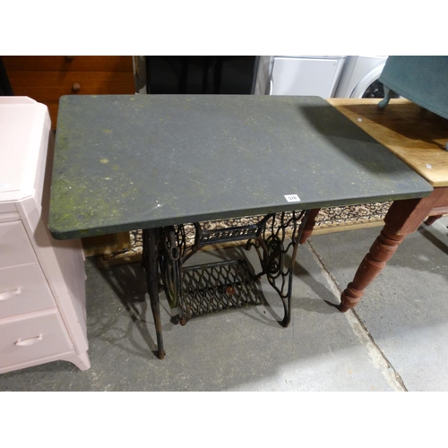 A Treadle Sewing Machine Base With Slate Top