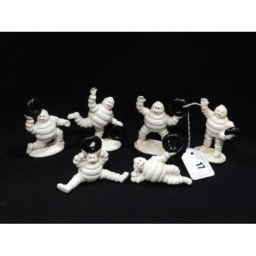 A Group Of Six Cast Iron Michelin Man Figures