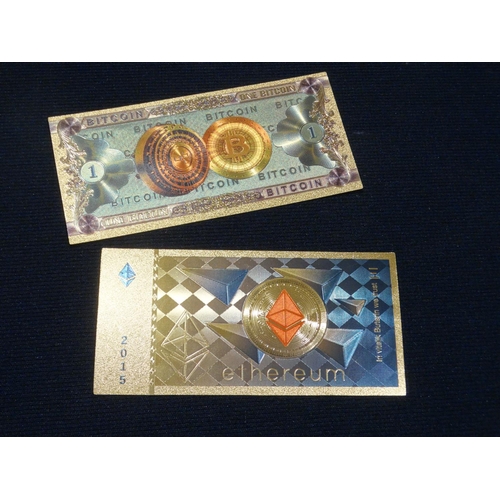 A Gold Plated Bitcoin Note, Together Wit An Ethereum Note
