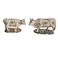 A PAIR OF VINTAGE CONTINENTAL FAIENCE POTTERY COWS Cow and bull with ...