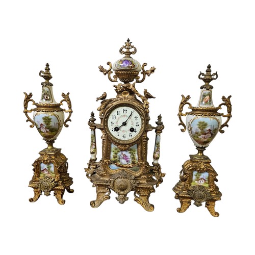A LATE 19TH CENTURY FRENCH GILT METAL CLOCK AND GARNITURE With ...