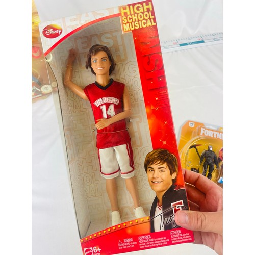 A collection of 4 unopened action figures including Troy form High ...