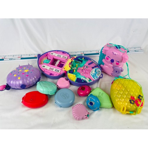 A collection of vintage Polly Pocket toys