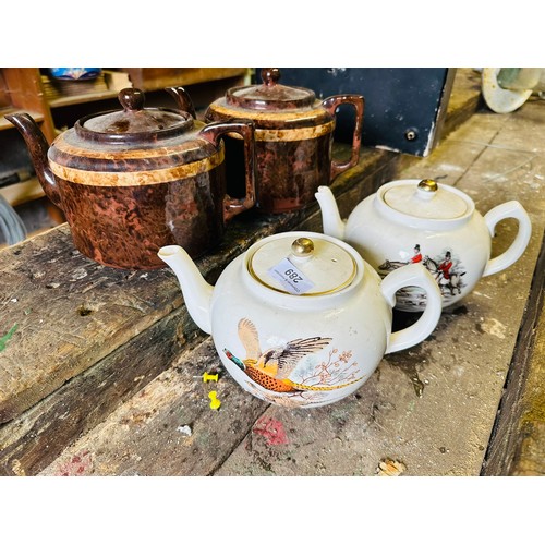 A collection of 4 teapots (2 with chips)