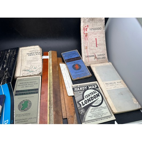 A large collection of vintage maps of Ireland, rulers and others