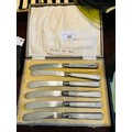 Encased set of 6 knives with hallmarked silver and ivor handles