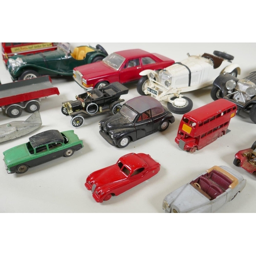 A collection of diecast metal scale model cars including Burago ...