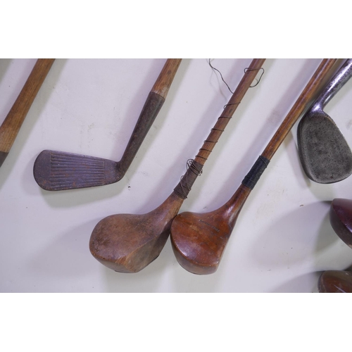 Collection of antique and vintage golf clubs, the majority stamped ...