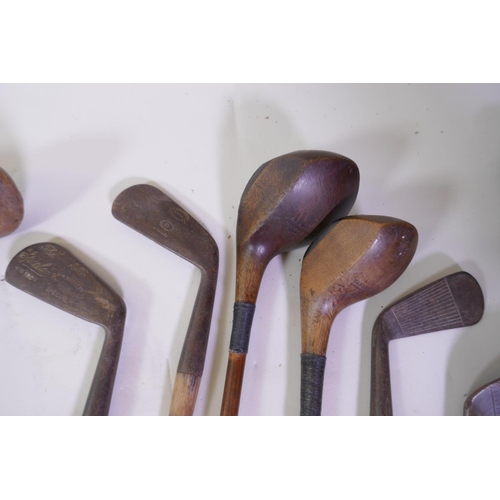 Collection of antique and vintage golf clubs, the majority stamped ...