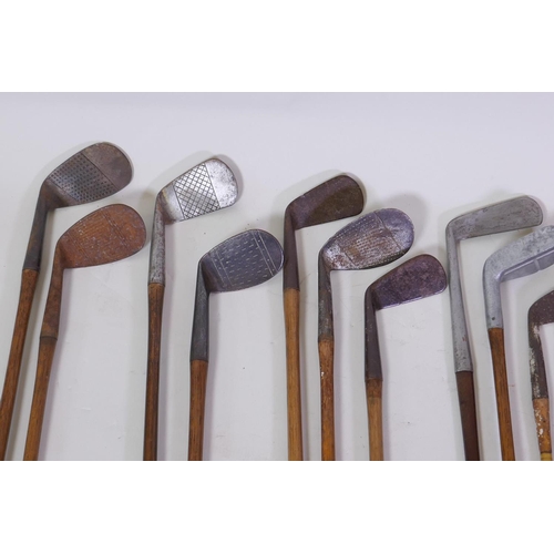 Collection of antique and vintage golf clubs, various makers, A. ?bes ...