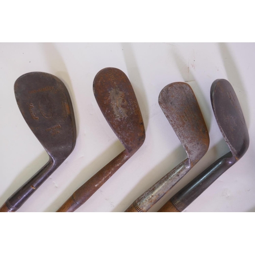 Collection of antique and vintage golf clubs, various makers, A. ?bes ...