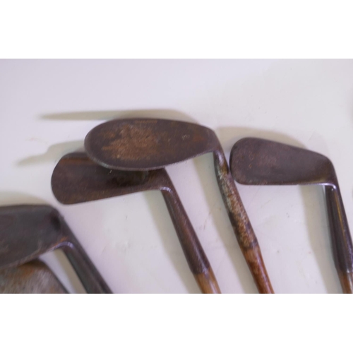 Collection of antique and vintage golf clubs, various makers, A. ?bes ...