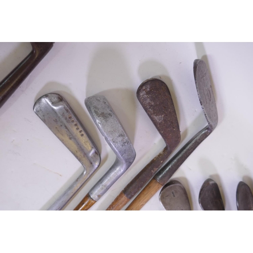 Collection of antique and vintage golf clubs, various makers, A. ?bes ...