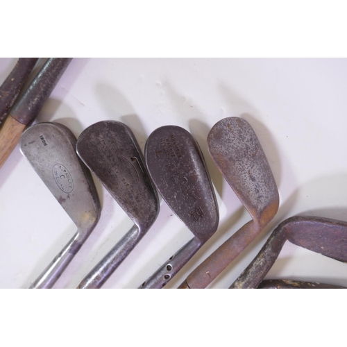 Collection of antique and vintage golf clubs, various makers, A. ?bes ...