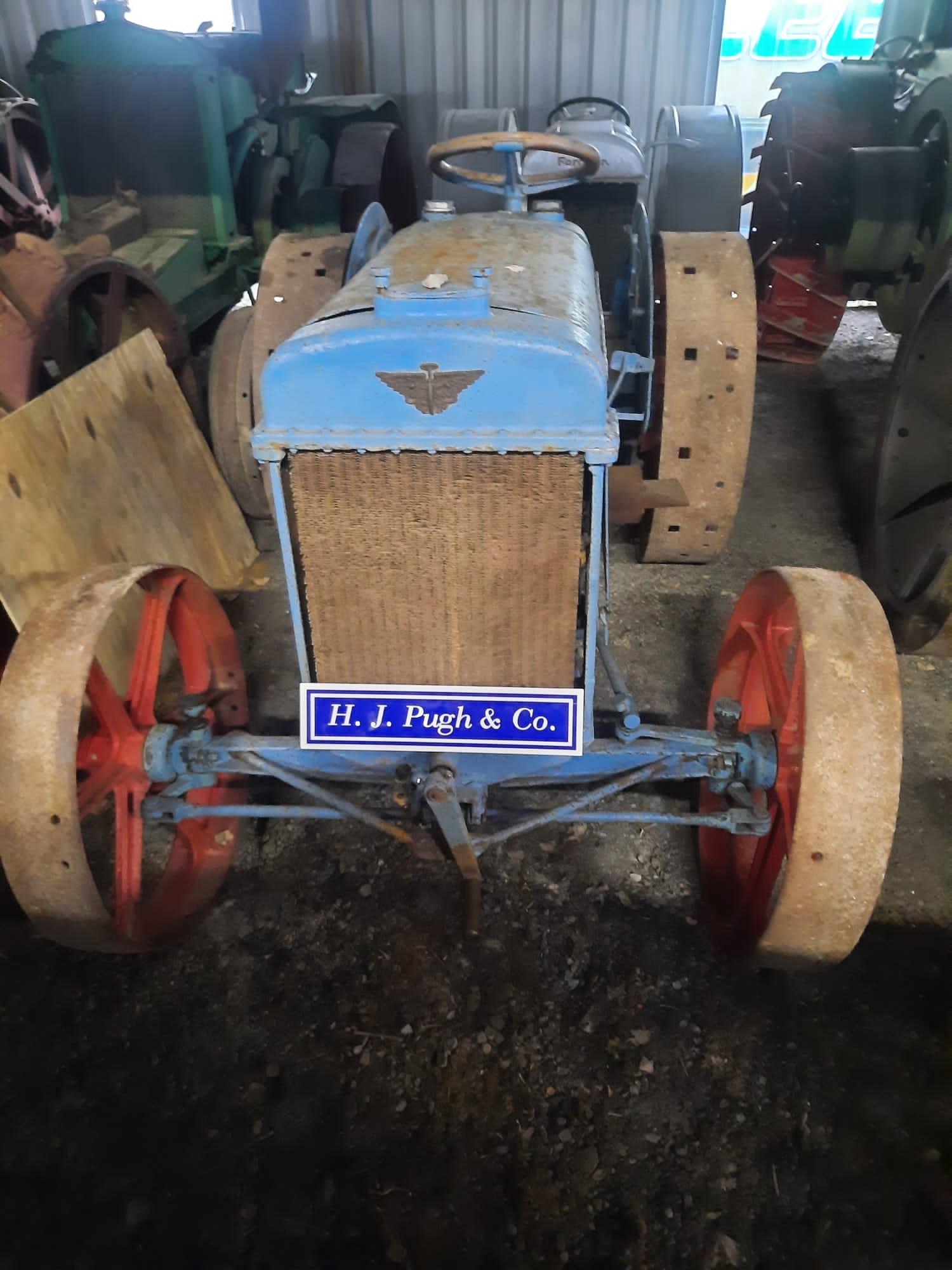 Early Austin tractor, on steel wheels. Engine needs recommissioning