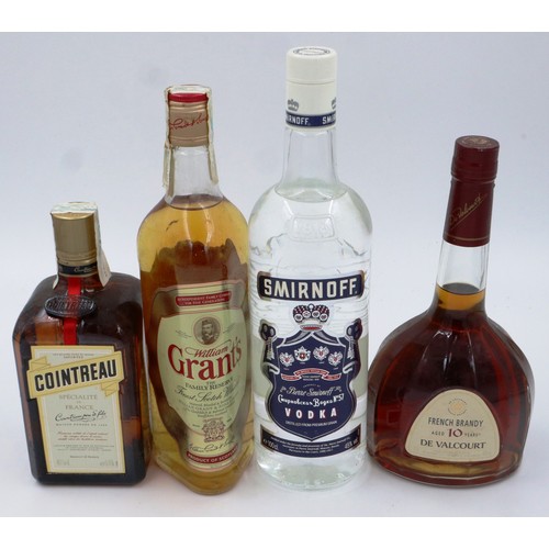 Four mixed spirits and liquors including a 100cl bottle of Smirnoff ...